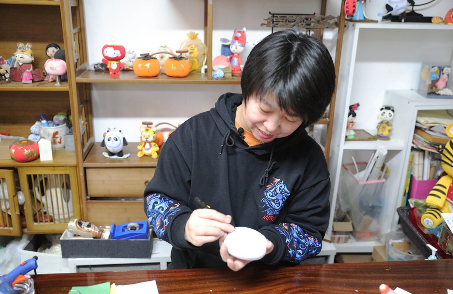 In Pics: Paper pleating artwork helps to promote spirit of Beijing ...