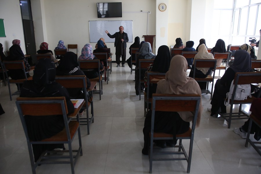 Optimistic female Afghan students attend university classes-Xinhua