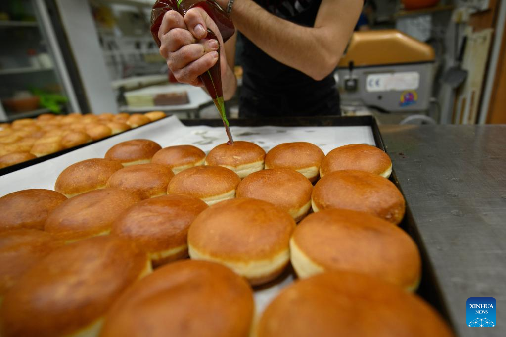 Bakery workers make donuts in Kiryat Shmona, northern Israel-Xinhua