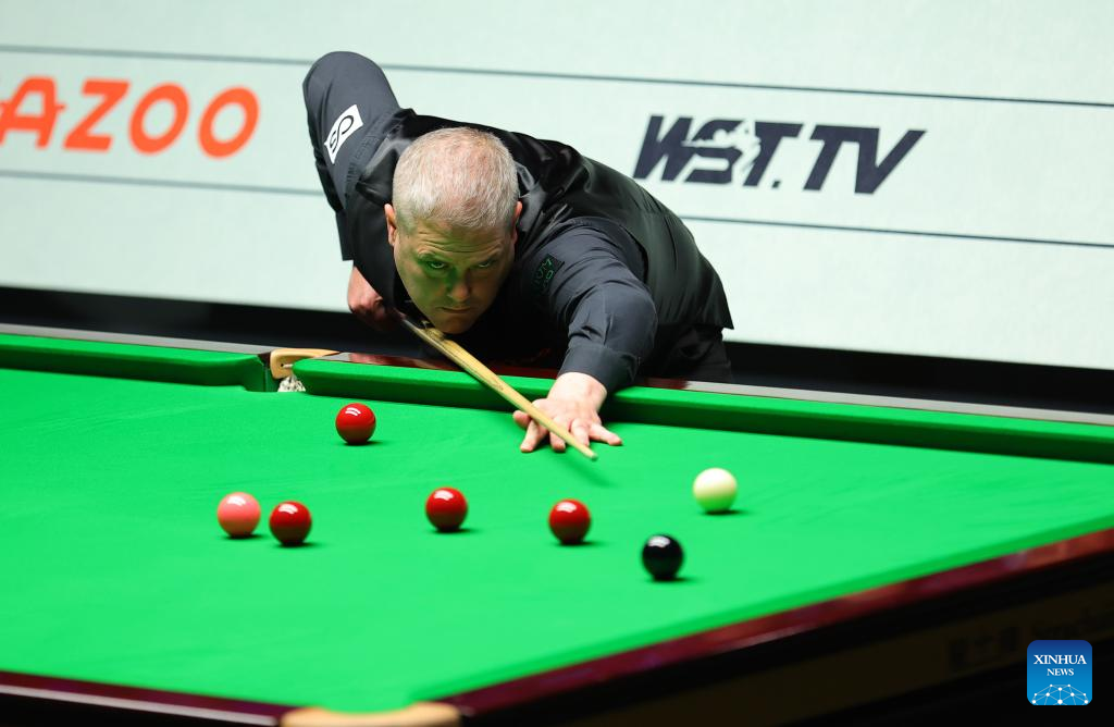 China's Si advances into quarterfinals at snooker worlds-Xinhua