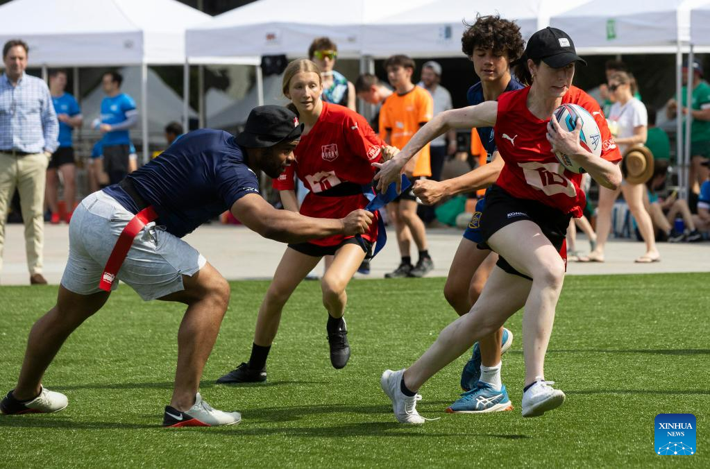 Participants compete during Rugby in Square Tournament in Toronto-Xinhua