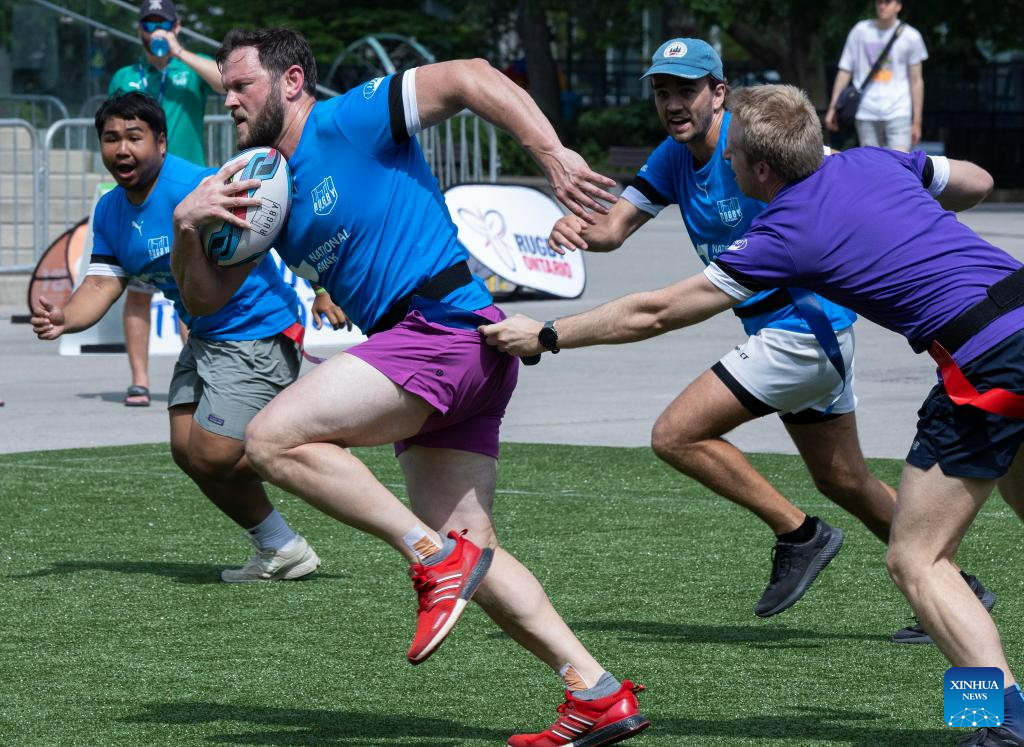 Participants compete during Rugby in Square Tournament in Toronto-Xinhua