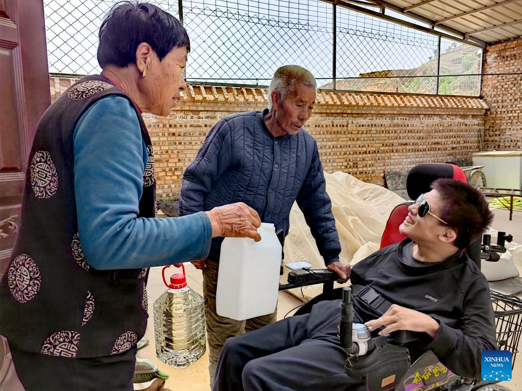 Across China: Disabled farmer glides on wings of poetry-Xinhua