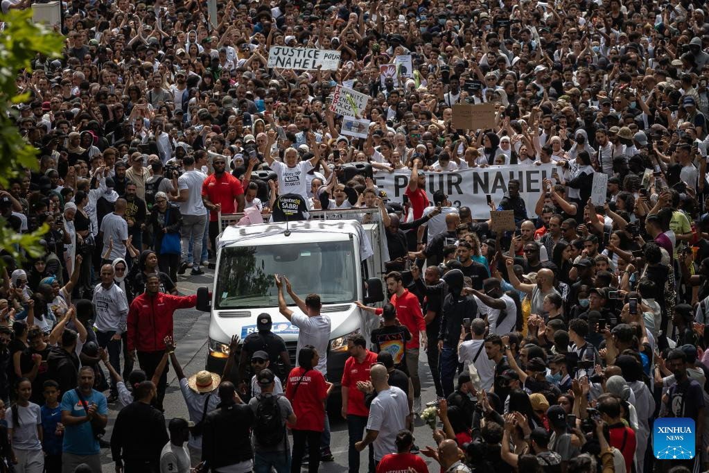Protesters clash with riot officers at march for killed teenager in ...