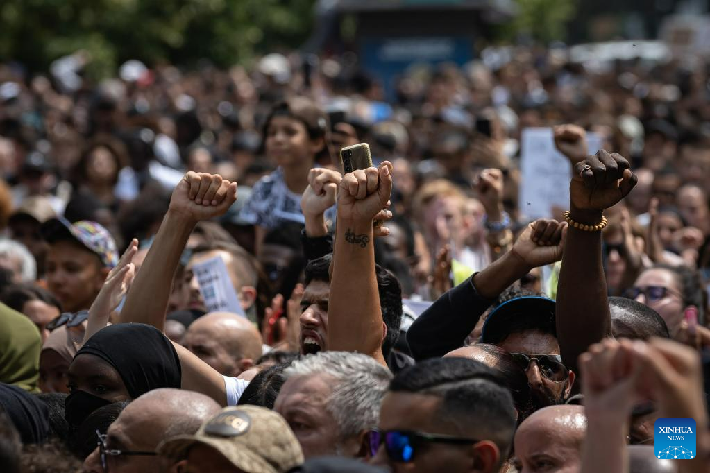 Protesters clash with riot officers at march for killed teenager in ...