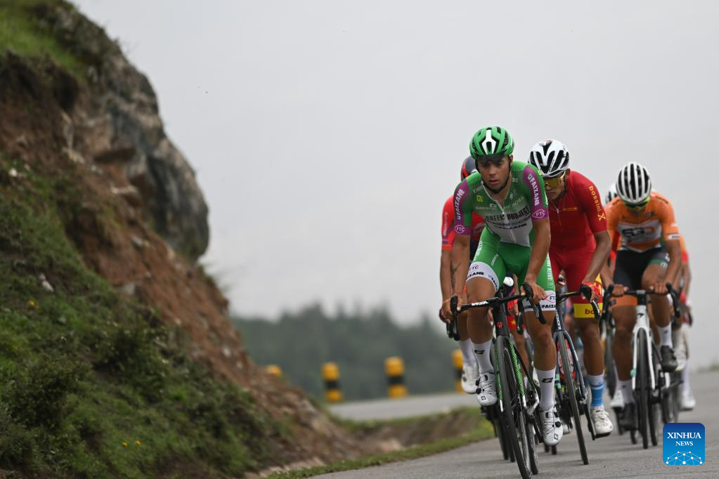 Riders compete during 22nd Tour of Qinghai Lake cycling race-Xinhua