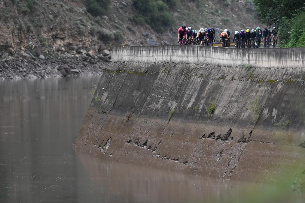 Riders compete during 22nd Tour of Qinghai Lake cycling race-Xinhua