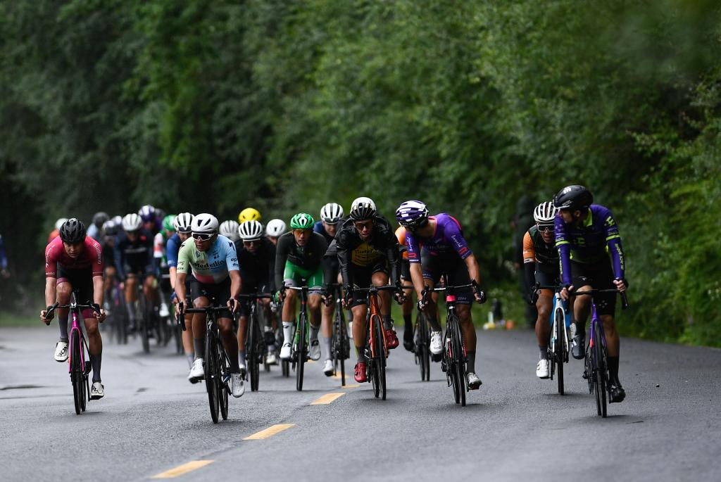 Riders compete during 22nd Tour of Qinghai Lake cycling race-Xinhua