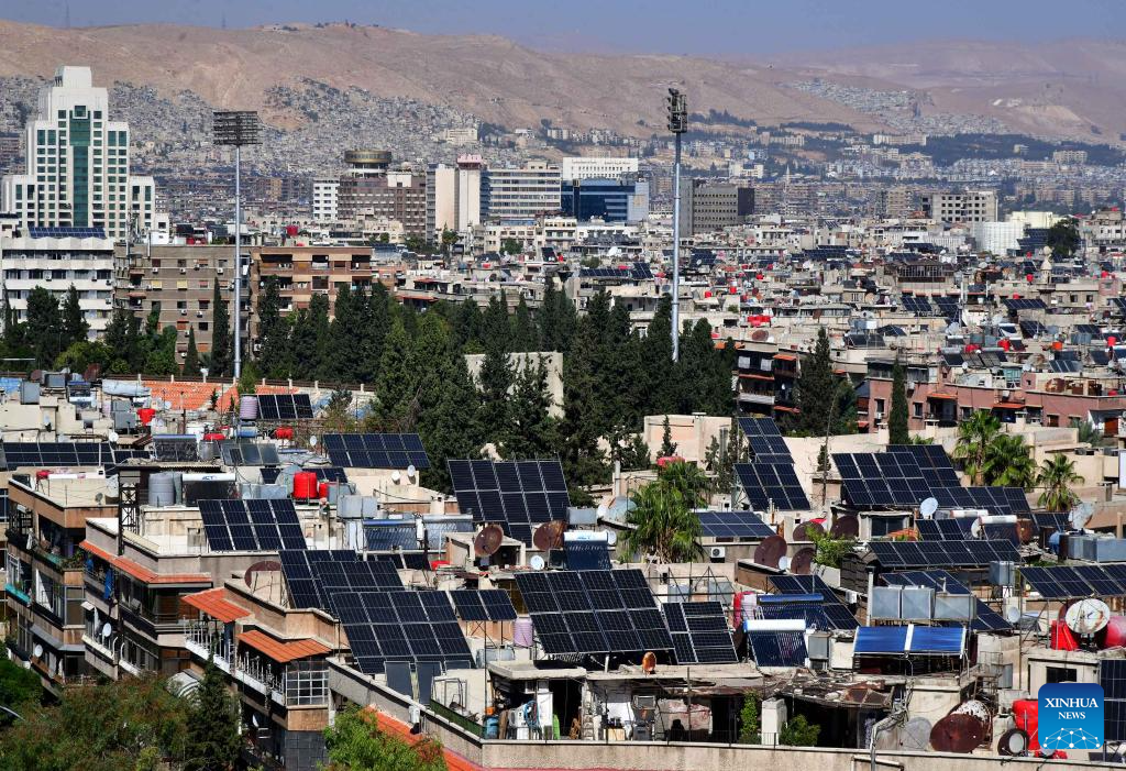 Solar panels seen on rooftops in Damascus, Syria -Xinhua