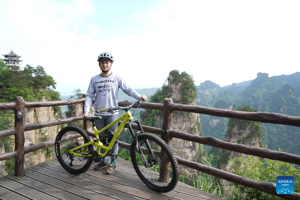 China's downhill mountain bikers enjoy ultimate thrills in enchanting ...