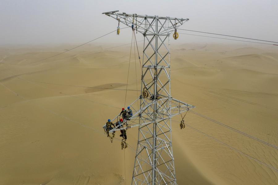 Power project with China's highest-altitude tower completed in Xinjiang ...