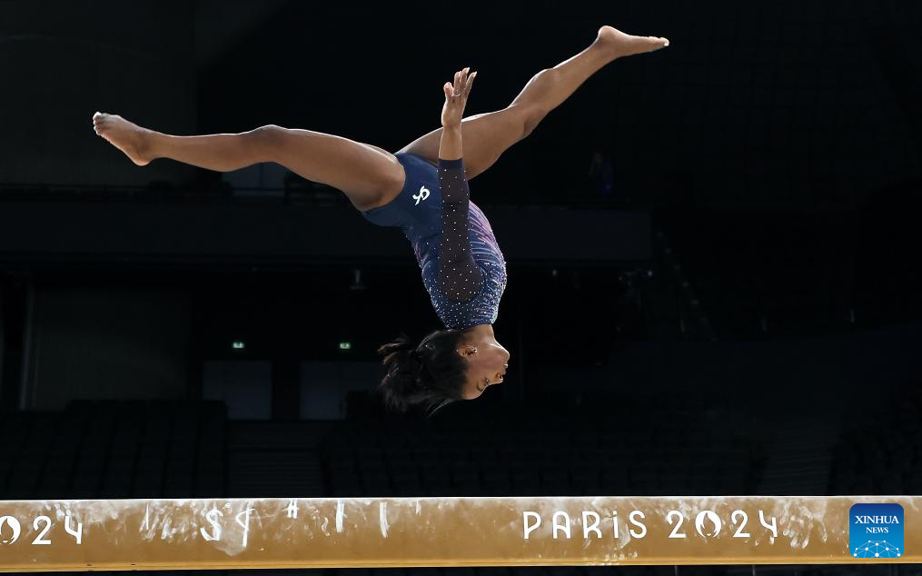 Members of team United States participate in artistic gymnastics ...