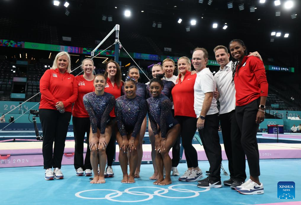 Members of team United States participate in artistic gymnastics ...
