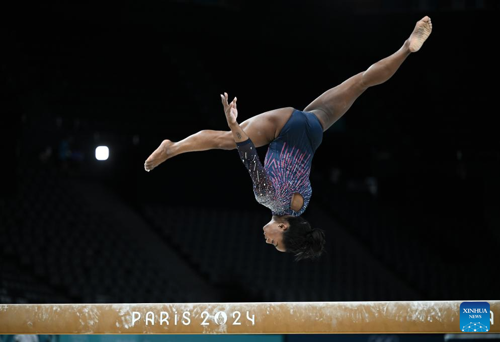 Members of team United States participate in artistic gymnastics ...