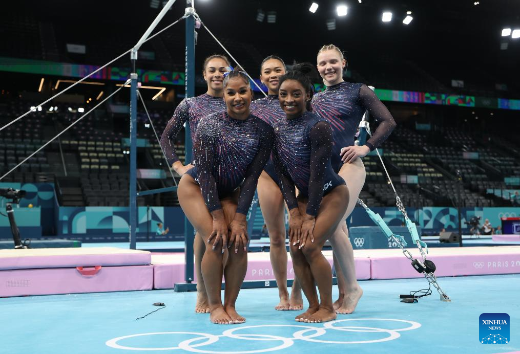Members of team United States participate in artistic gymnastics ...