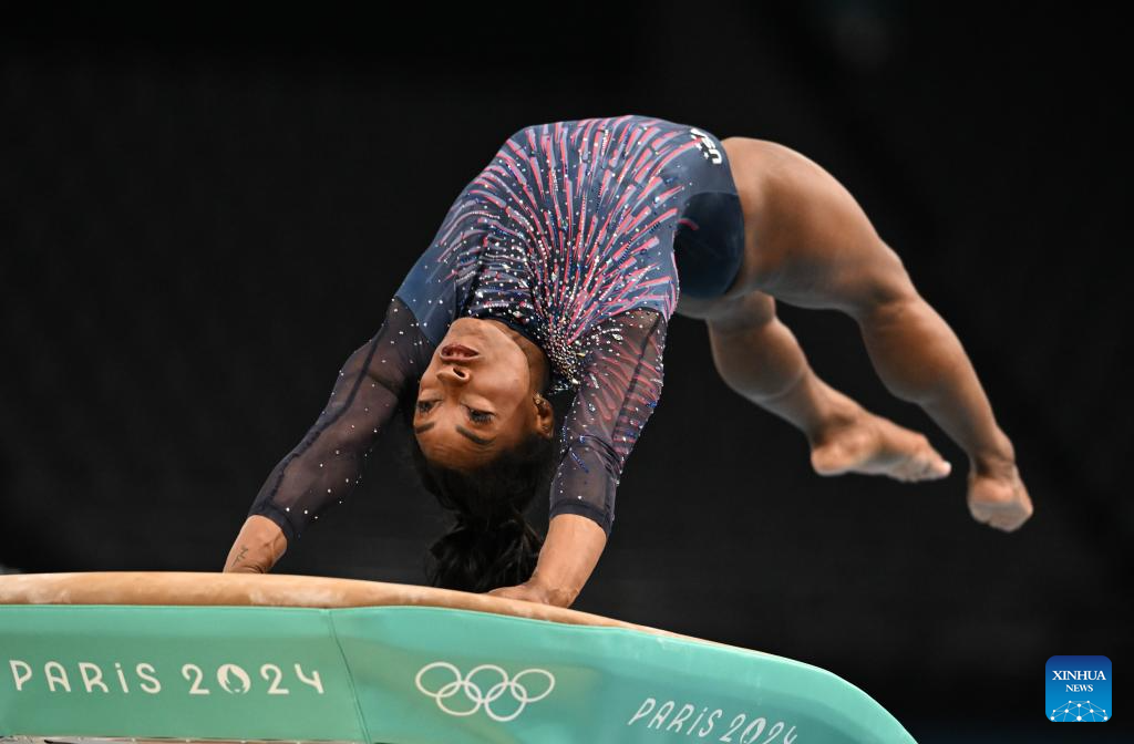 Members of team United States participate in artistic gymnastics ...