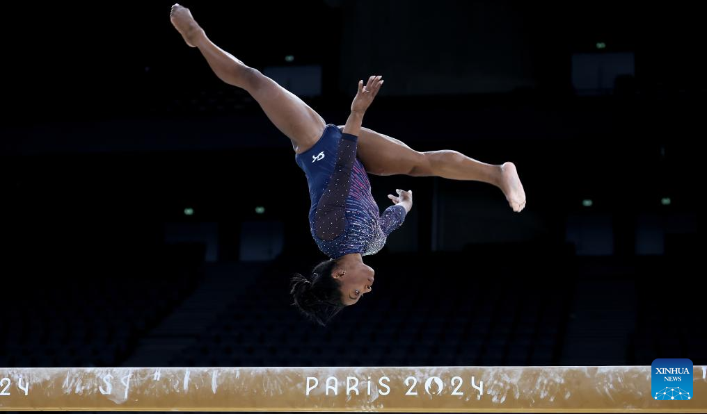Members of team United States participate in artistic gymnastics ...