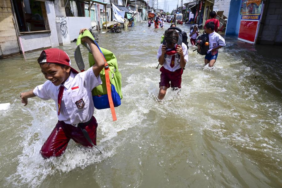 Asia Album: Streets in Indonesia's Jakarta flooded due to rising sea ...