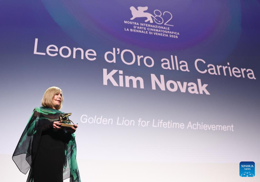 Kim Novak receives Golden Lion for Lifetime Achievement trophy during ...