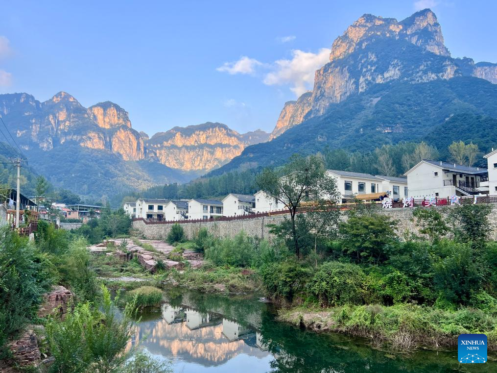 Across China: Cliffside "sky road" turns isolated valley into summer ...