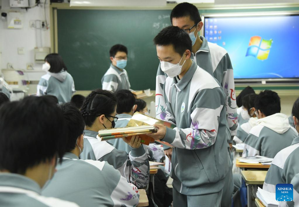 Primary and middle school students in Beijing return to school for ...