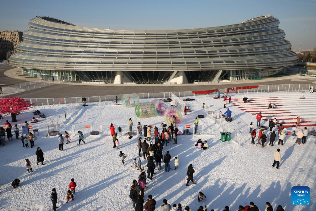 People have fun with ice and snow at National Speed Skating Oval in ...