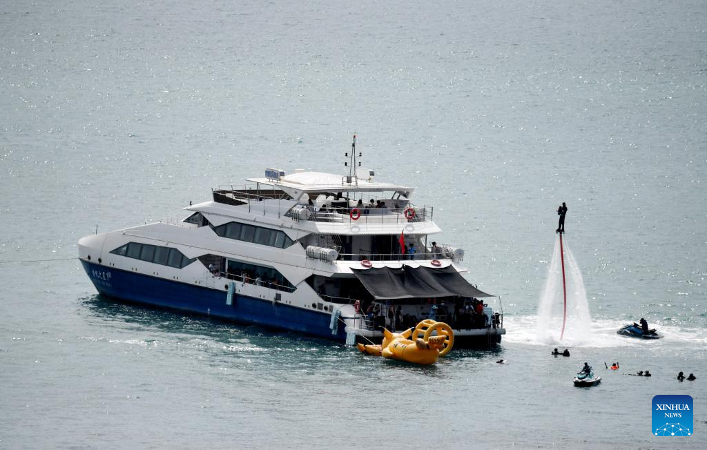 Tourists take yachts to have fun in Sanya, China's Hainan-Xinhua