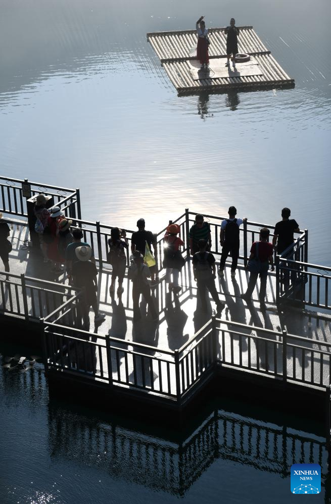 Tourists visit Dongjiang Lake scenic spot in Hunan-Xinhua
