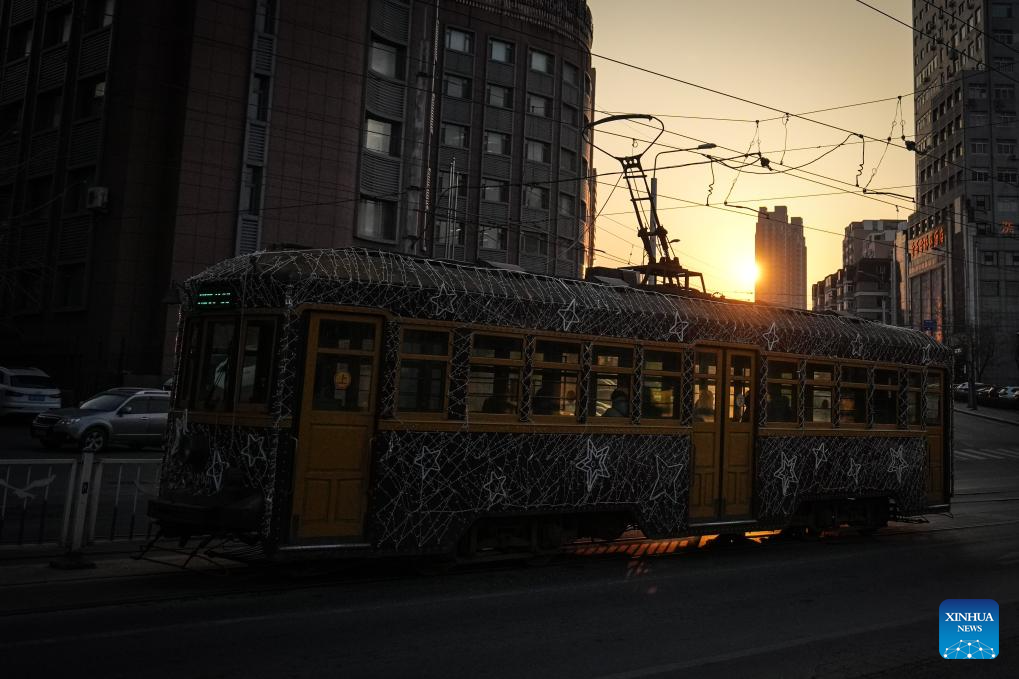 Trams decorated with lights to attract tourists in Dalian, China's ...