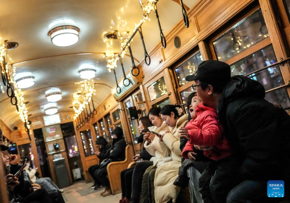 Trams decorated with lights to attract tourists in Dalian, China's ...