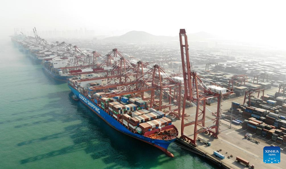 Qingdao port busy handling goods for export during Spring Festival ...