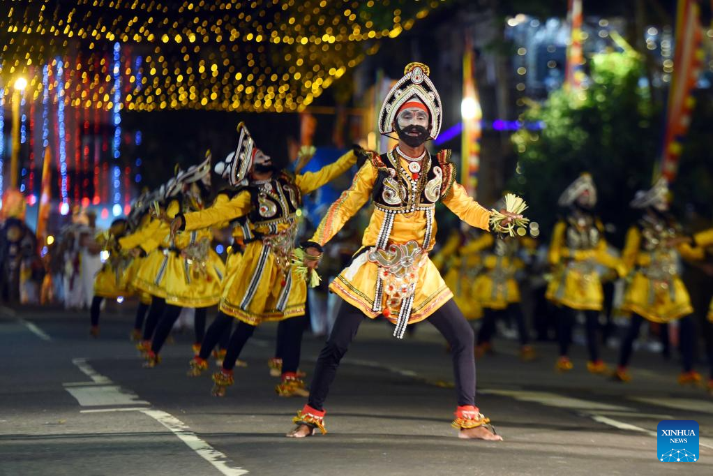 People perform traditional dances during annual Navam Perahera festival ...
