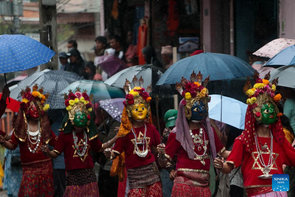 Masked dancers take part in parade in Kathmandu, Nepal-Xinhua