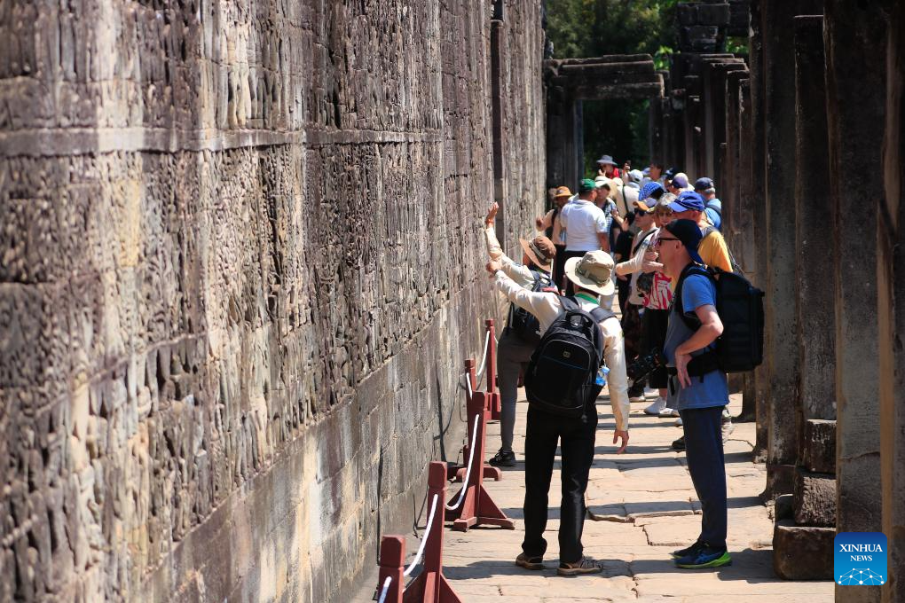 Tourists visit Angkor Wat Temple at UNESCO-listed Angkor Archaeological ...