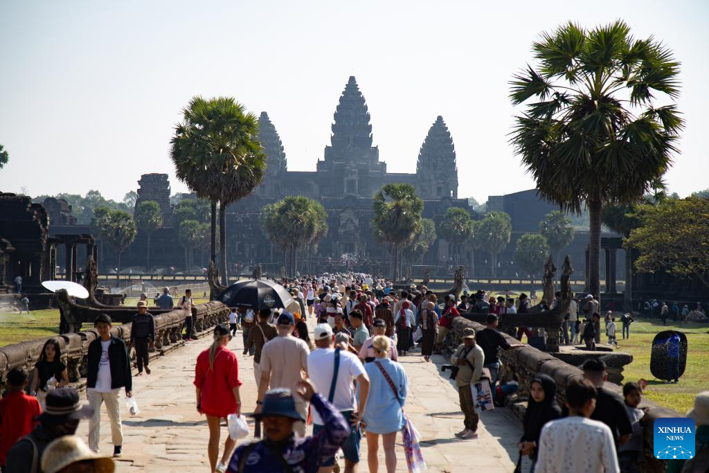 Tourists visit Angkor Wat Temple at UNESCO-listed Angkor Archaeological ...