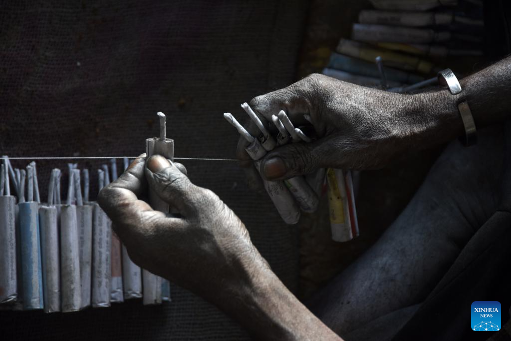 Workers make firecrackers at fireworks factory in Kimbulapitiya, Sri ...