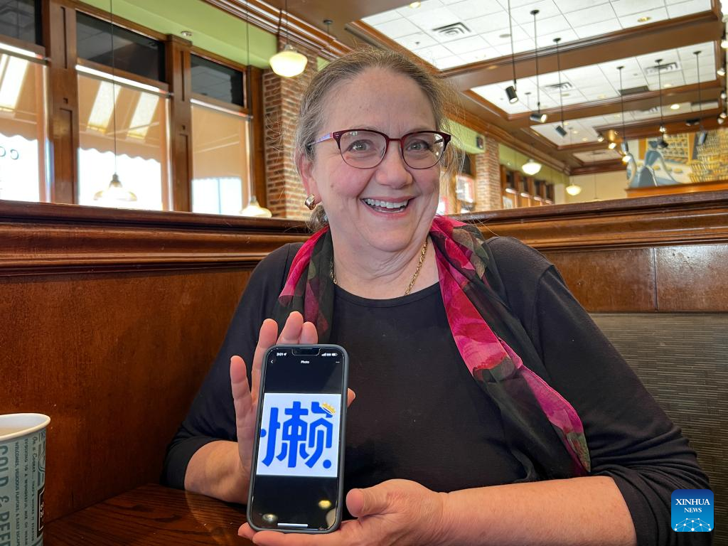Feature: Beyond language -- U.S. woman's decade-long Chinese learning ...
