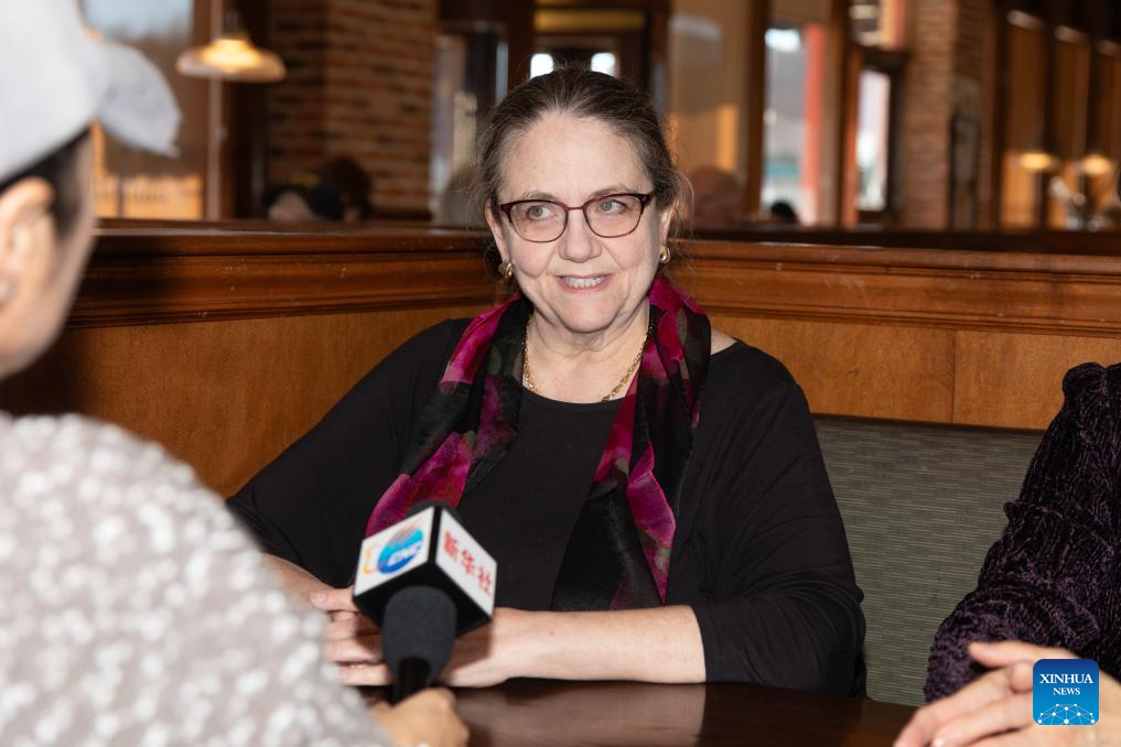 Feature: Beyond language -- U.S. woman's decade-long Chinese learning ...