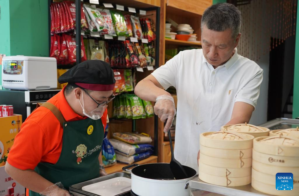 Across China: Dumpling restaurant serves up success for workers with ...